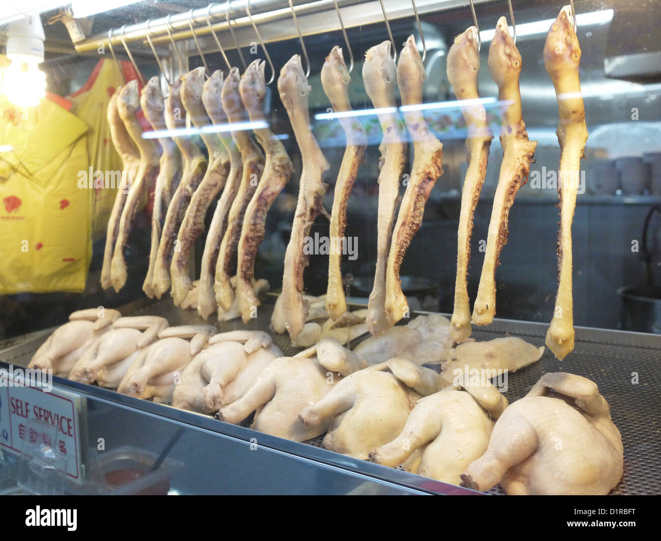 chicken head with neck hanging Stock Photo - Alamy
