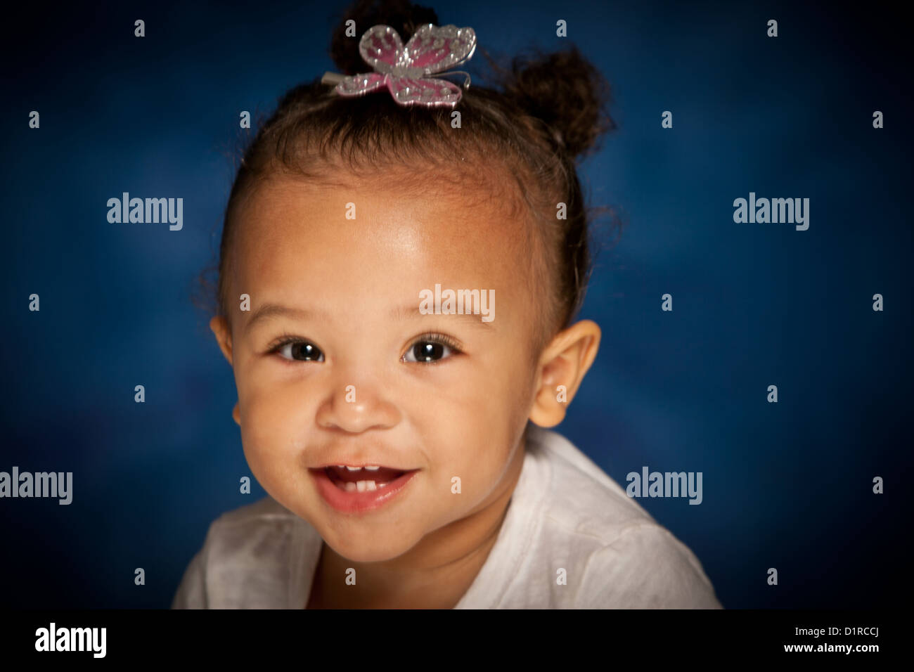 Cute studio portraits of little girl, mixed race under two years old ...