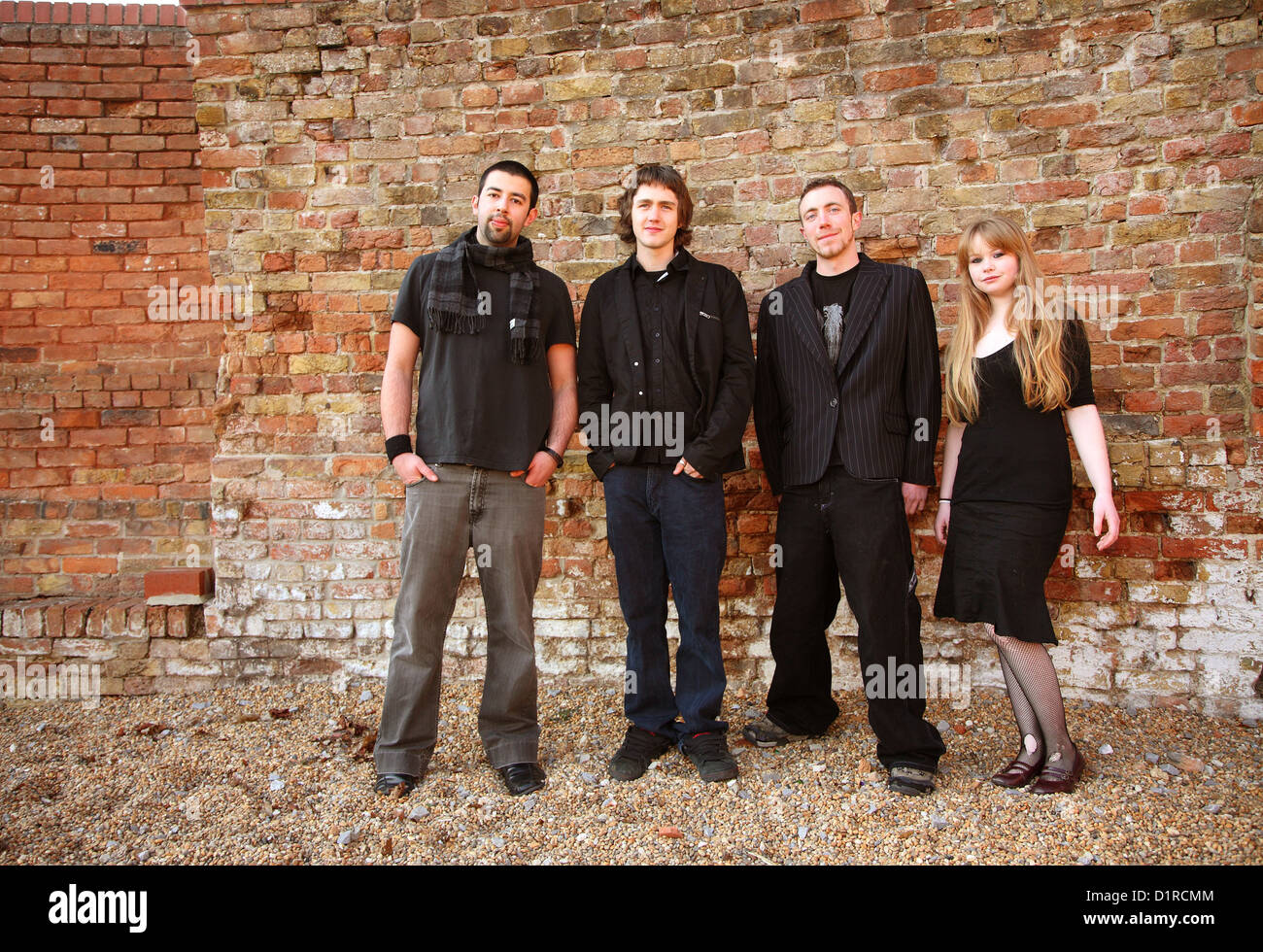 Teenage band members, posing for a group shoot to promote their band ...