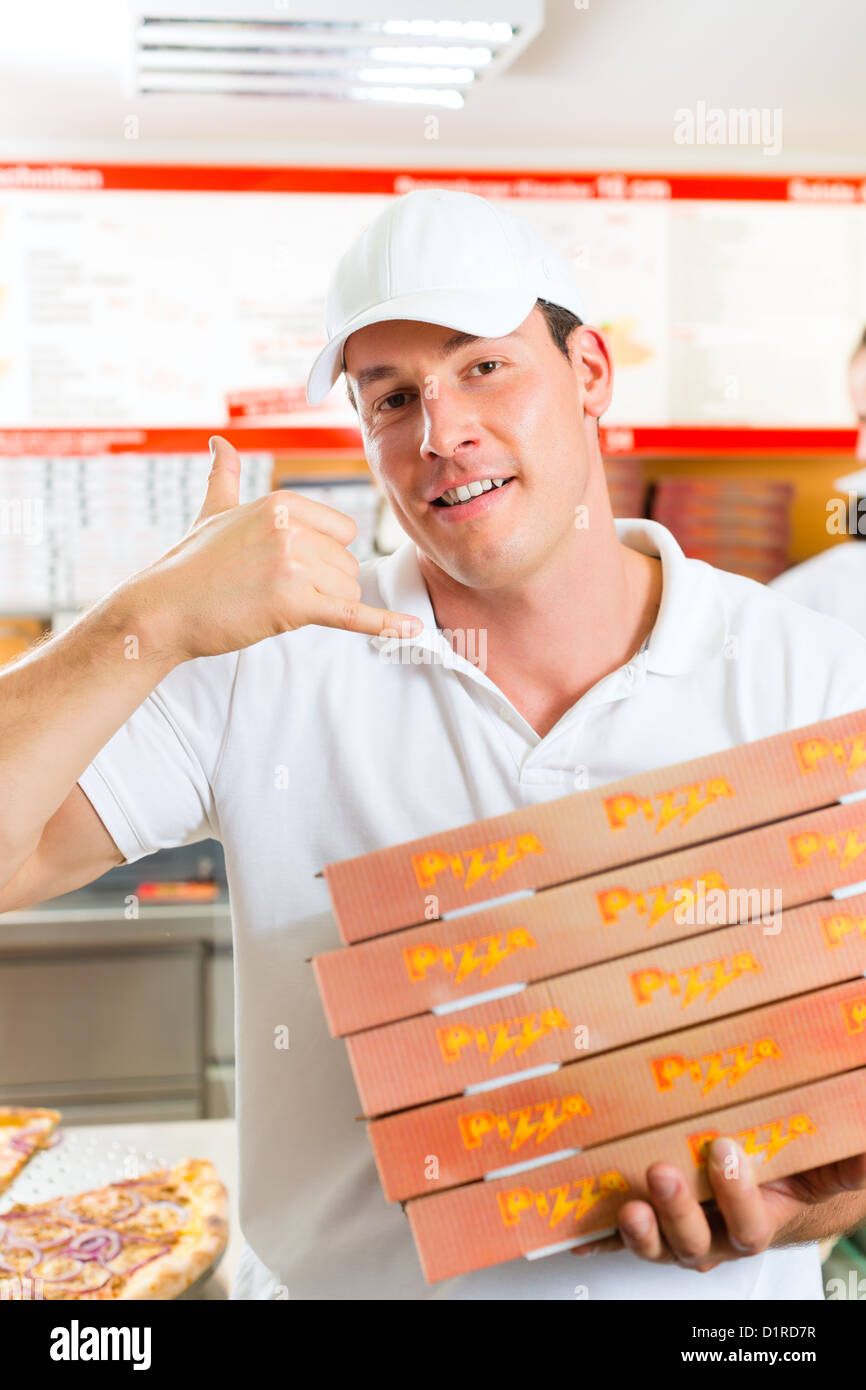 Man holding several pizza boxes in hand and asking you to order pizza ...