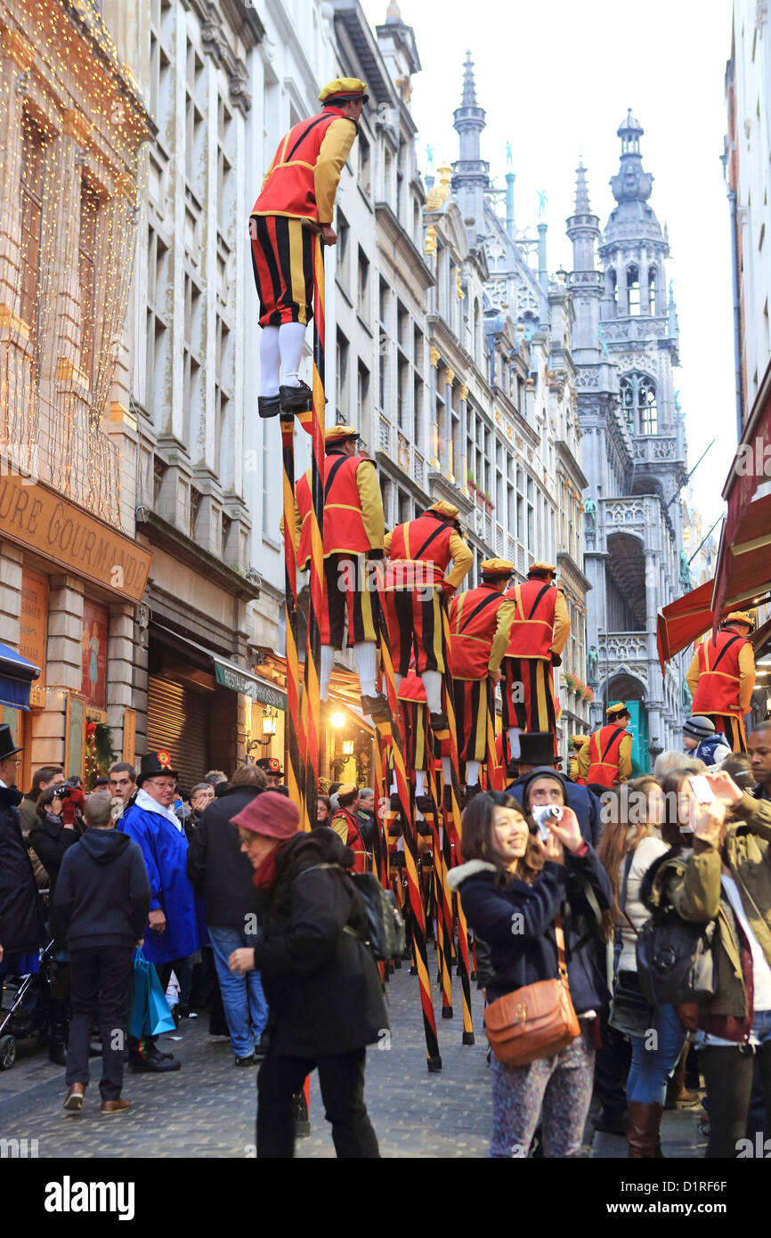 The Royal Stilt Walkers of Belgium process towards the Grand Place in ...