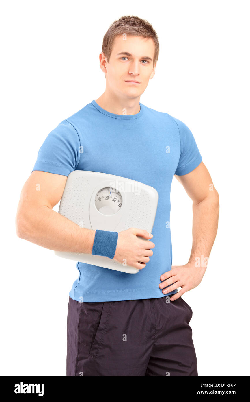 A male athlete holding a weight scale isolated on white background ...