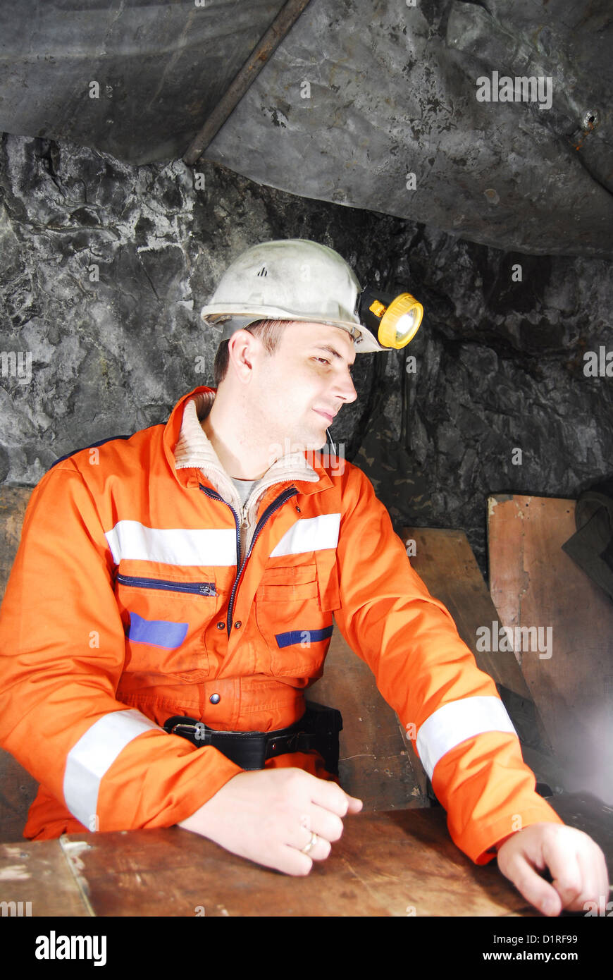 Miner in a mine shaft having break from work stock photo Stock Photo ...