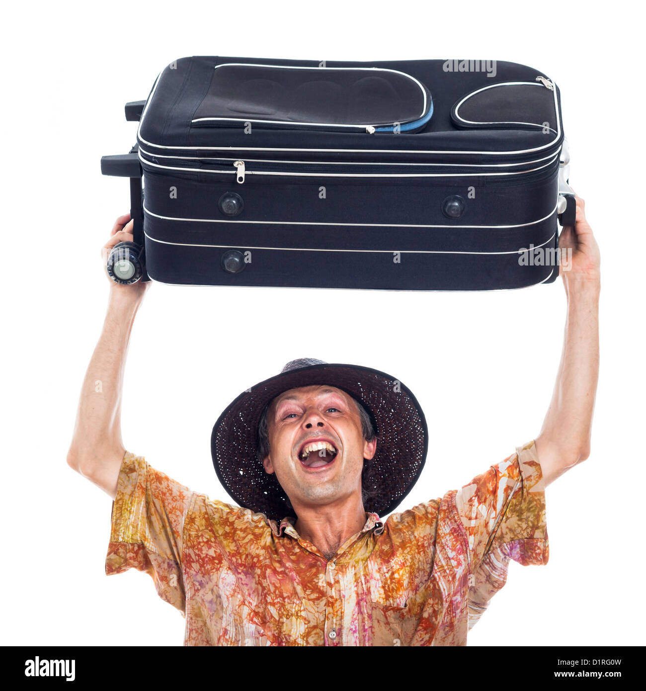 Ecstatic happy man travelling with luggage, isolated on white ...