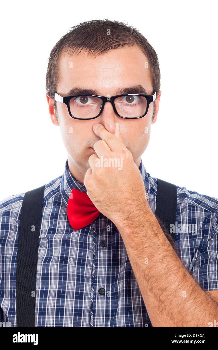 Close up of funny nerd man holding his nose, isolated on white ...
