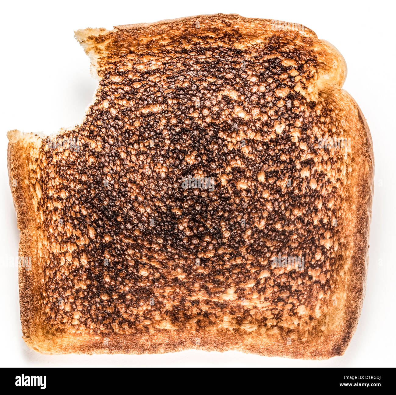 burnt toast white bread with bite on white bkg Stock Photo - Alamy