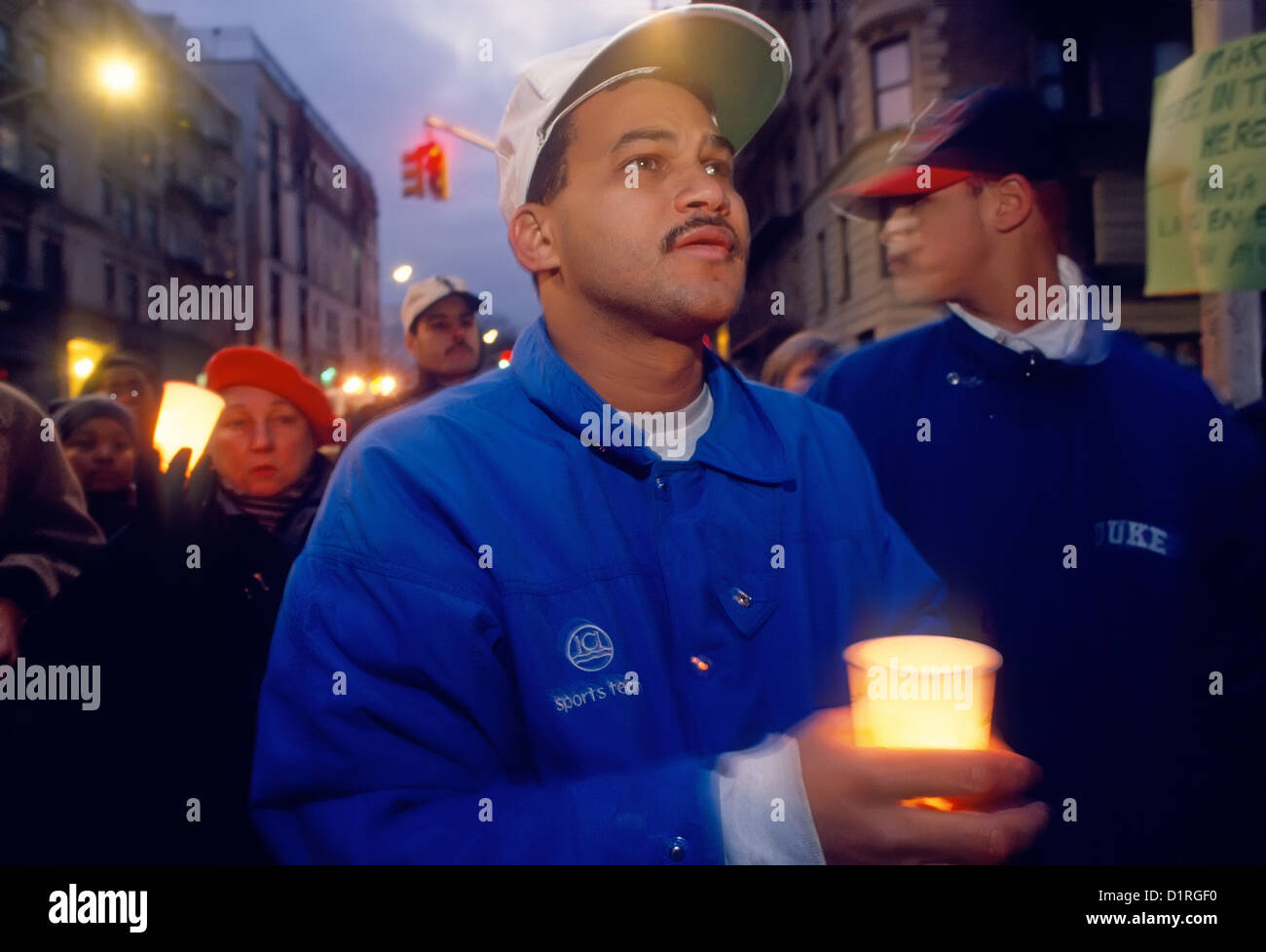 Fernando Mateo, founder of Toys for Guns, leads a candlelight march ...