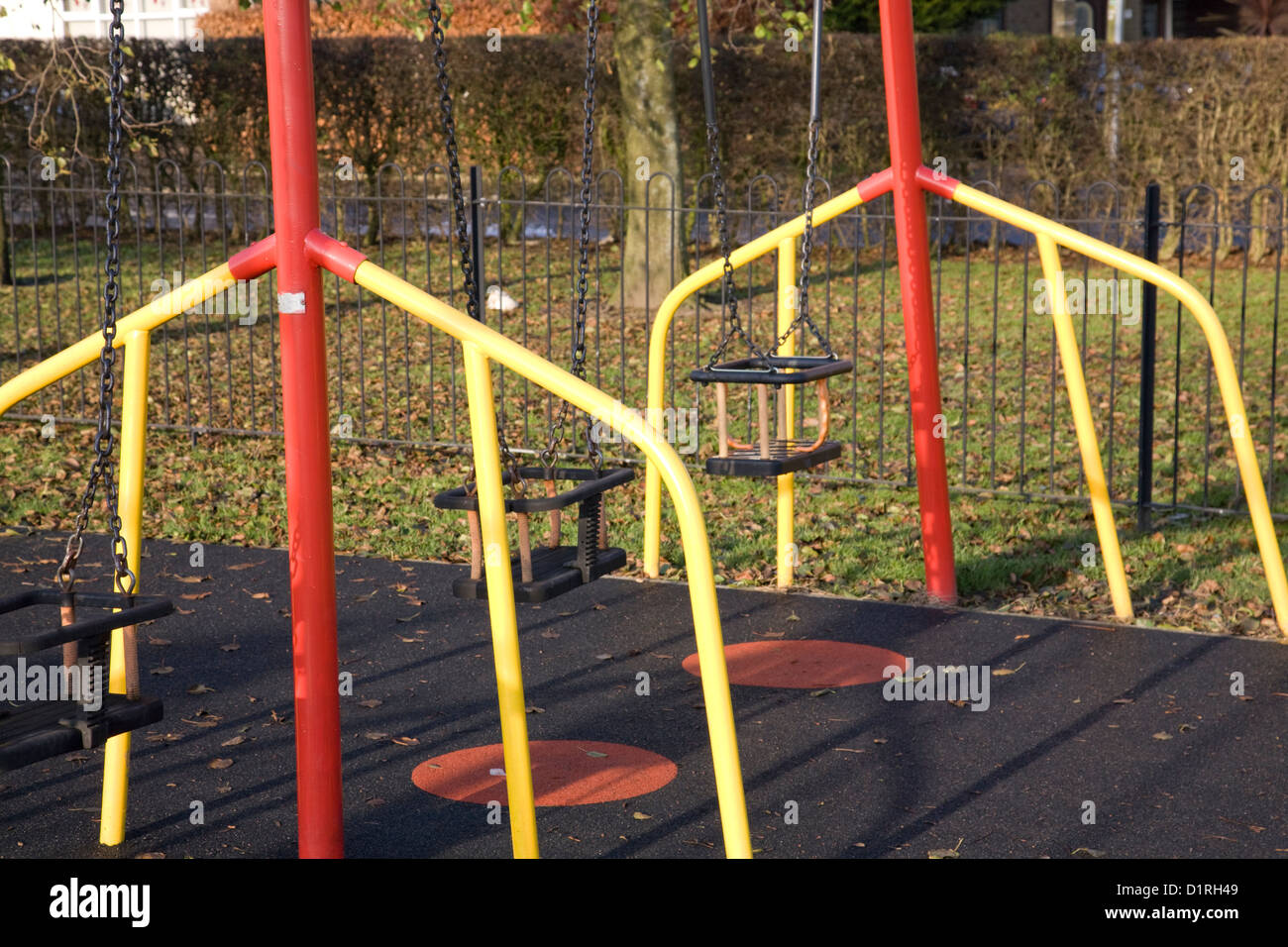 Childrens playground in Ramsbottom England on a snow and icy winters ...