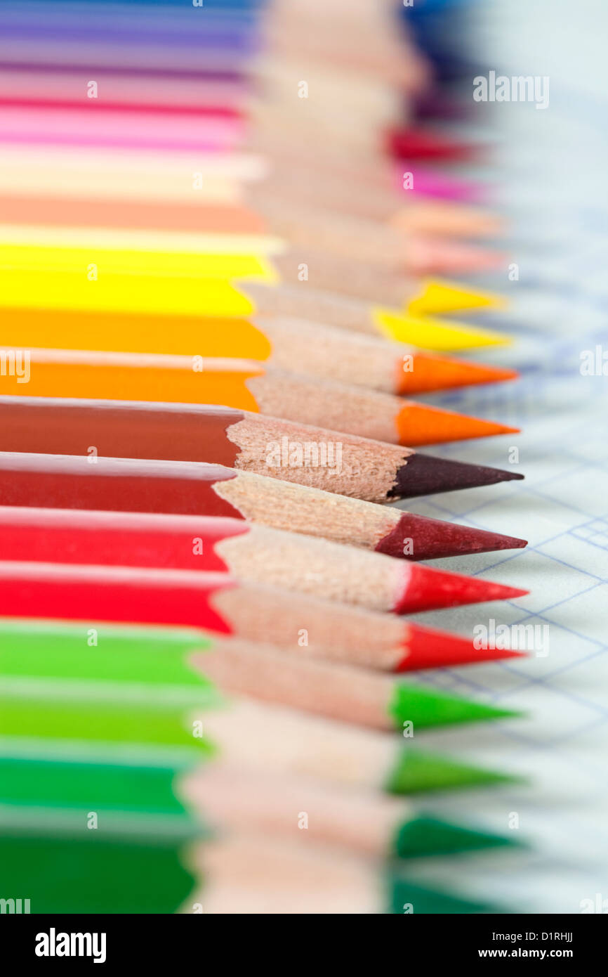 Color pencils in a neat row on blueprint Stock Photo - Alamy