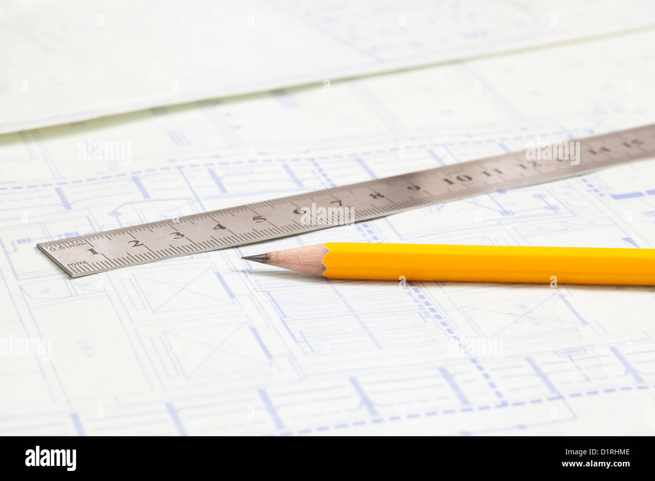 Steel ruler and sharpened pencil on blueprint Stock Photo - Alamy