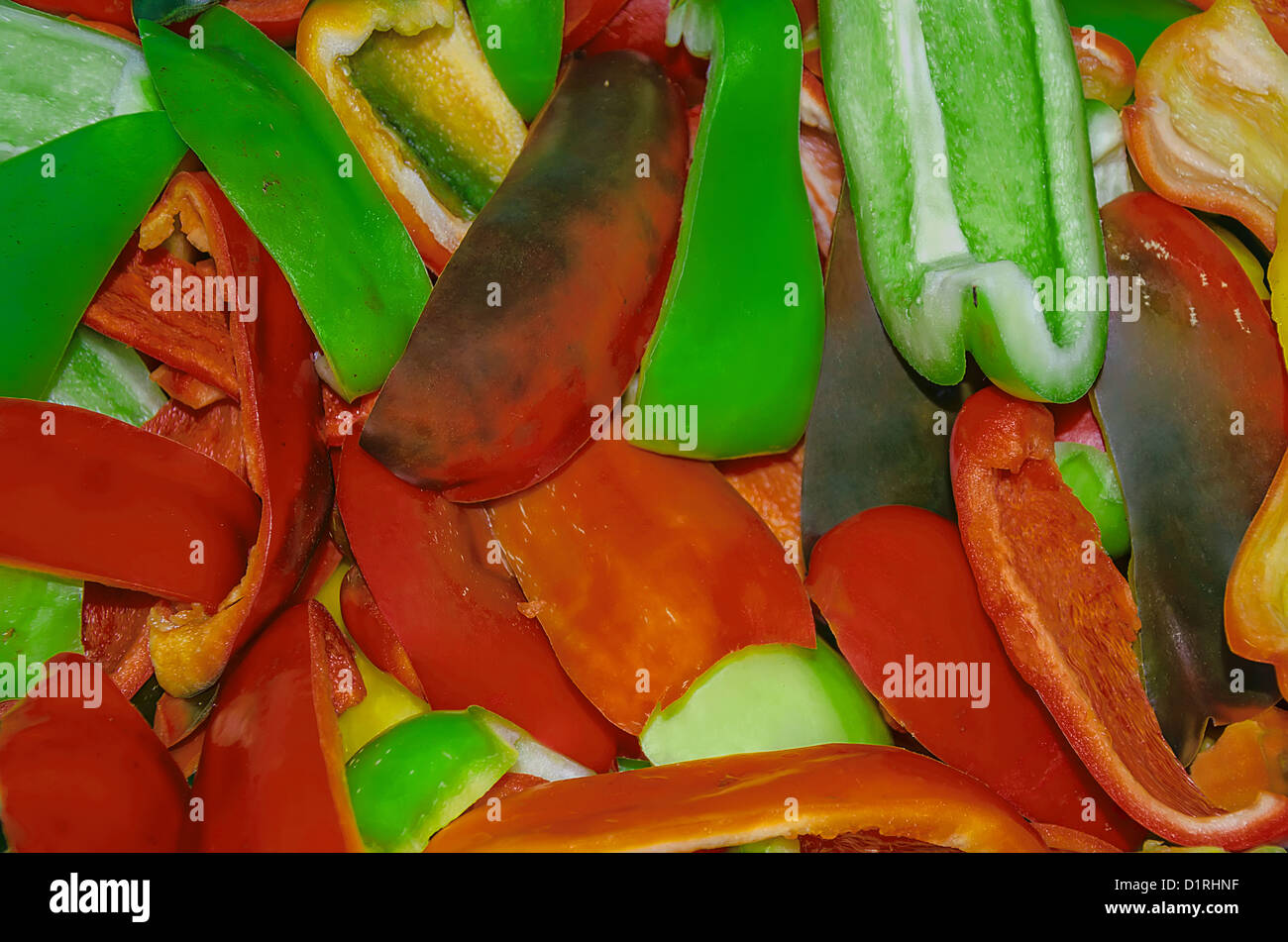 Multicolored peppers sliced in a chaotic manner Stock Photo - Alamy