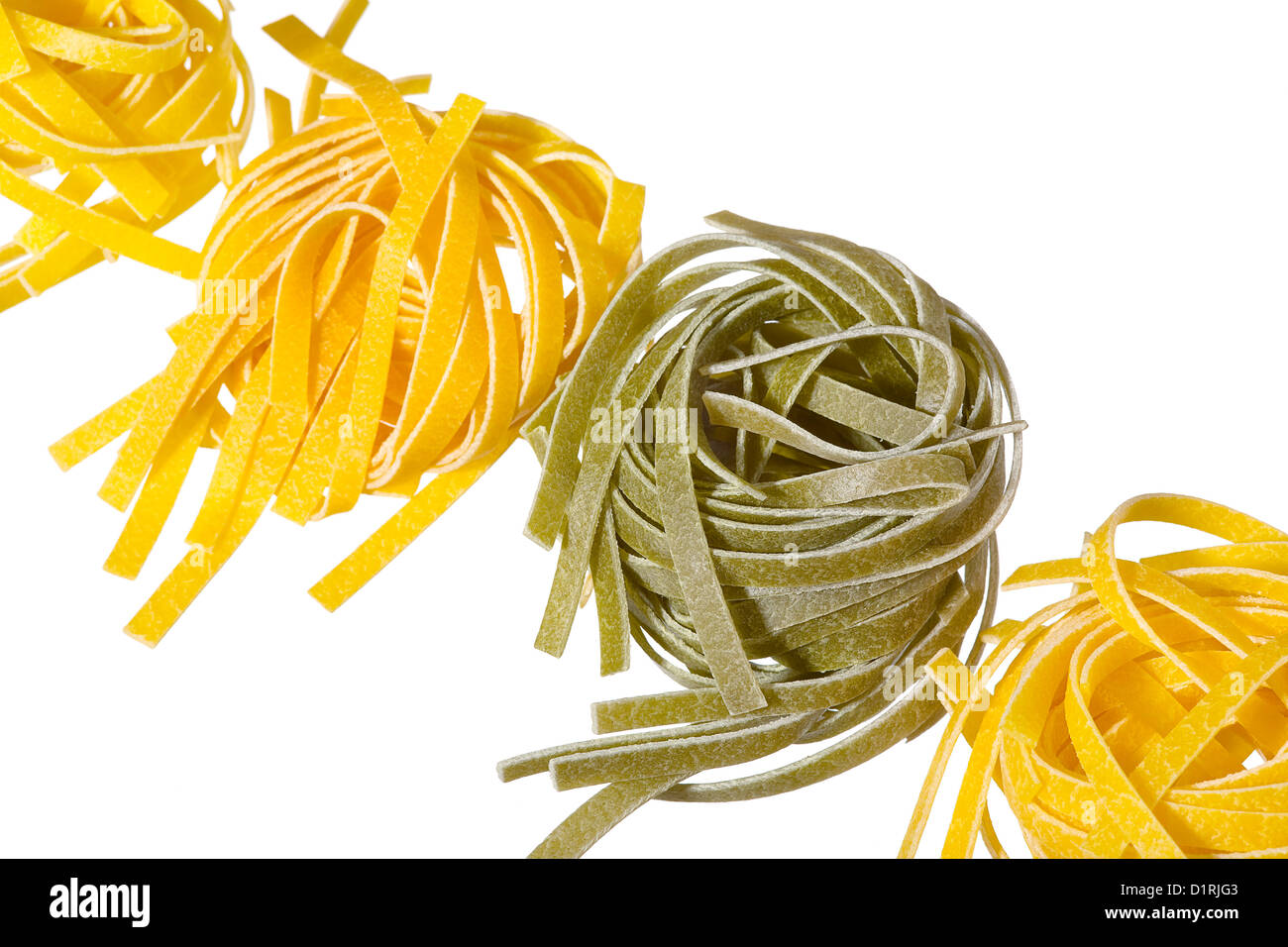 A raw colored pasta isolated on white background Stock Photo - Alamy