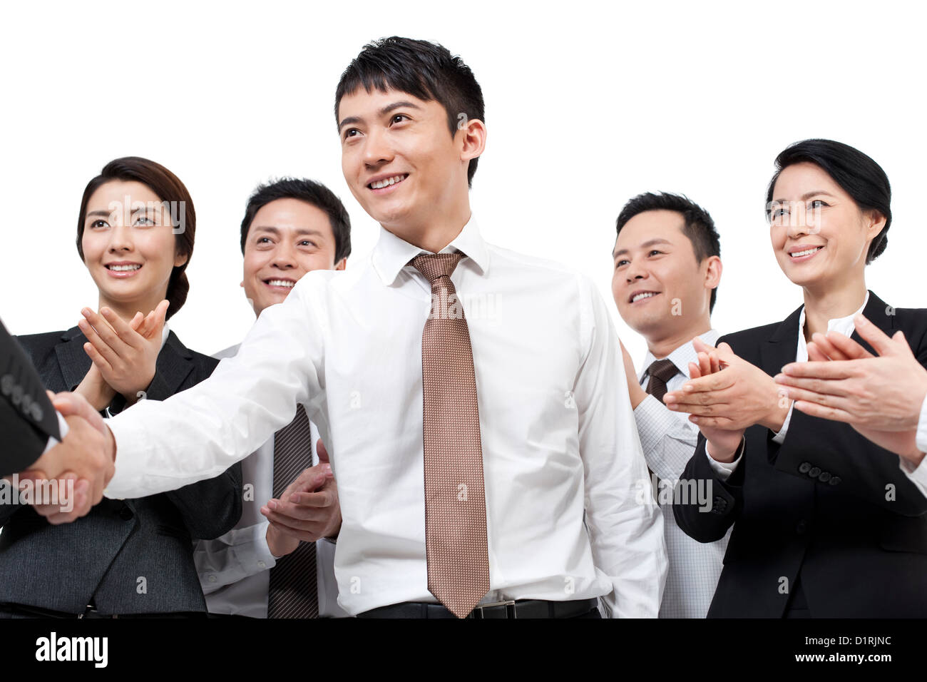 Business partners applauding successful cooperation hi-res stock ...