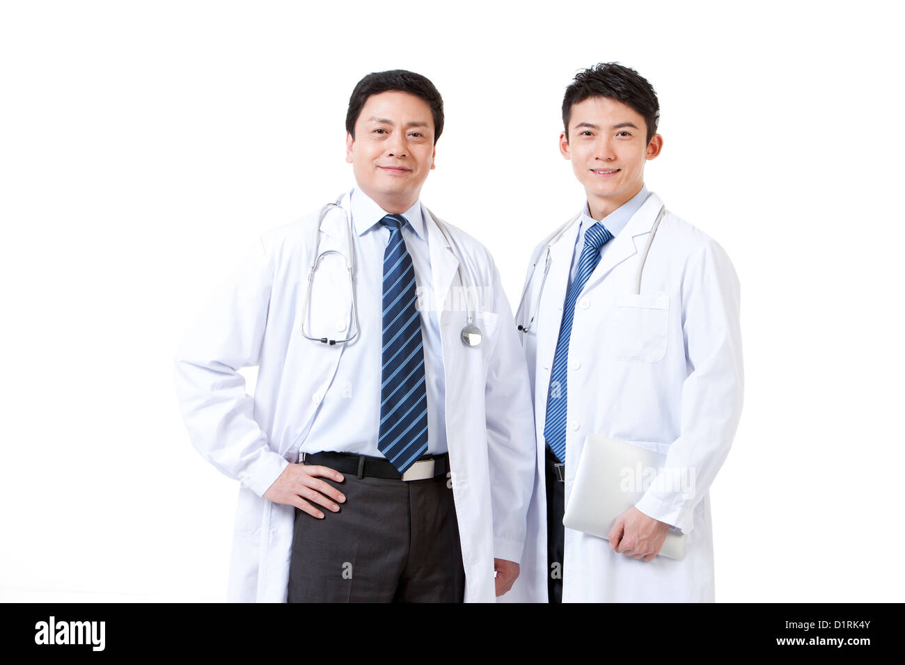 Portrait of two professional male doctors with digital tablet Stock ...