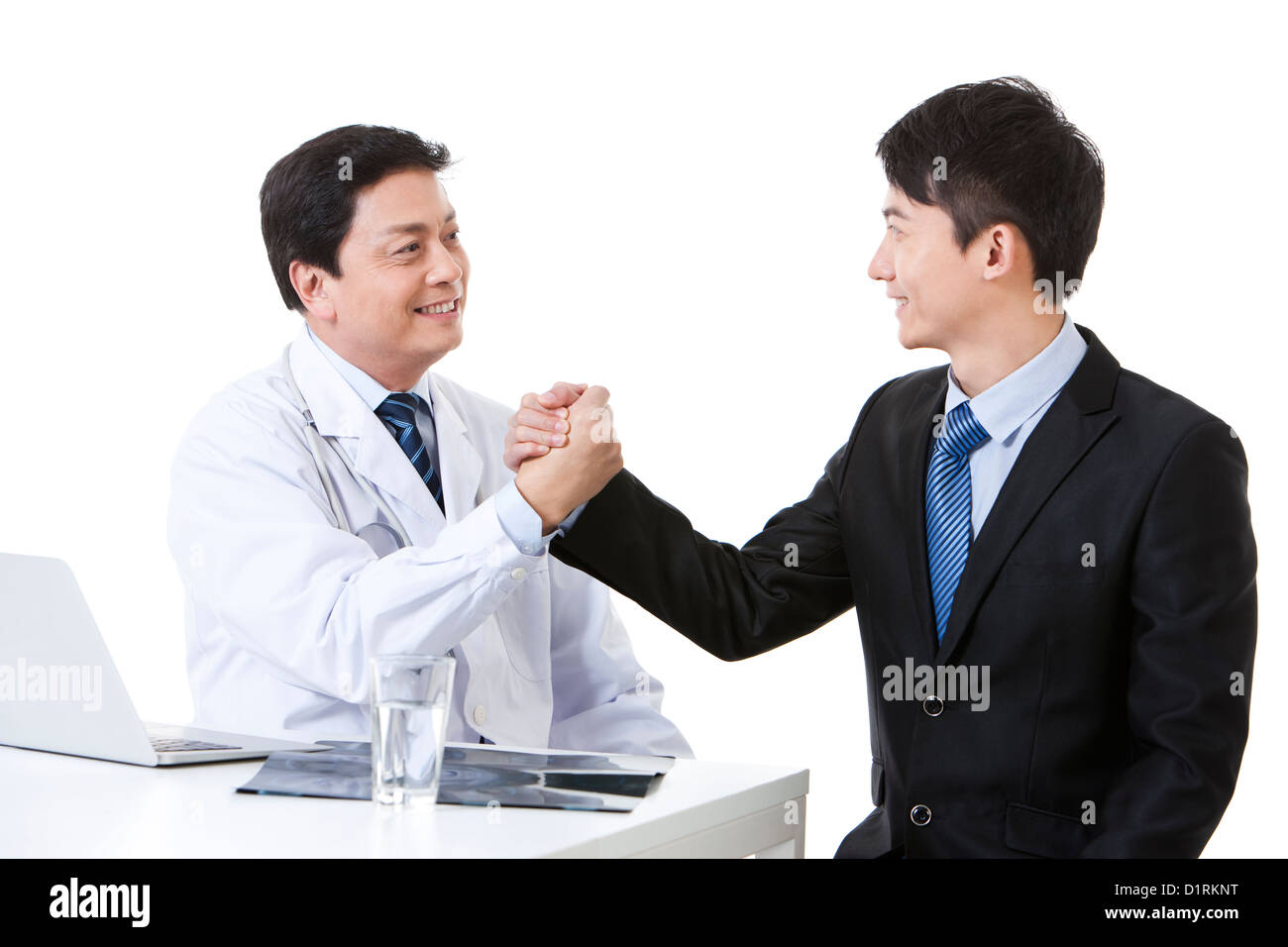 Professional doctors holding hands Stock Photo - Alamy