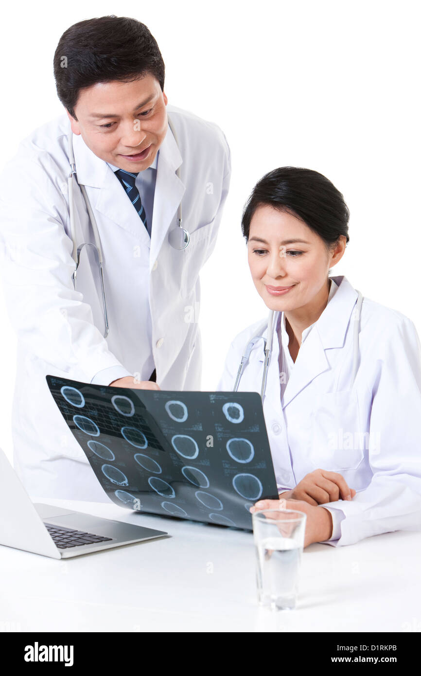Professional doctor checking X-ray image with colleague Stock Photo - Alamy