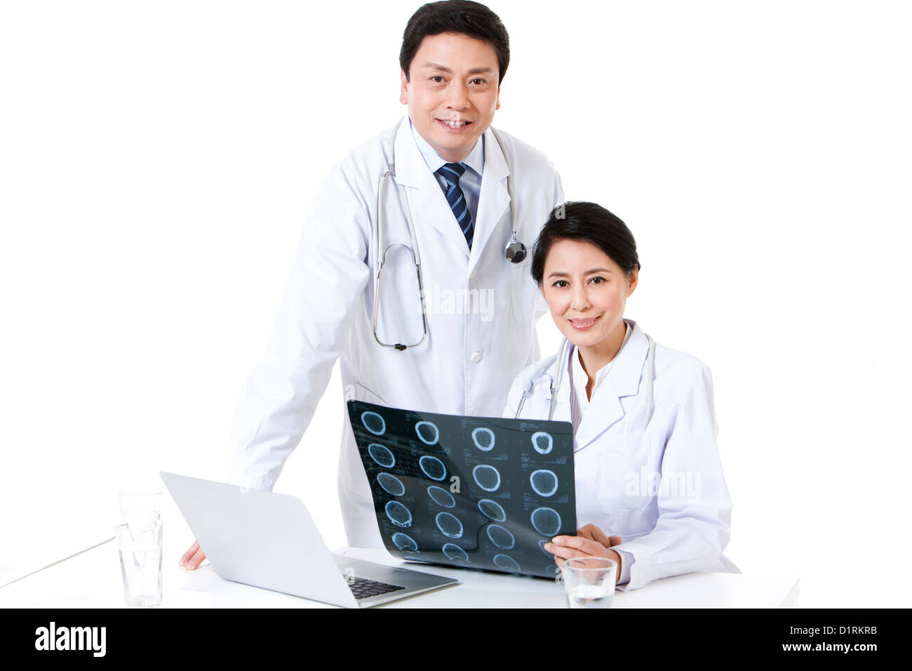 Professional doctor checking X-ray image with colleague Stock Photo - Alamy