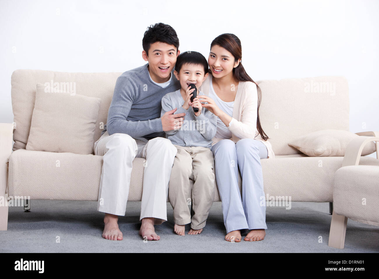 merry young family singing with a microphone at home Stock Photo - Alamy