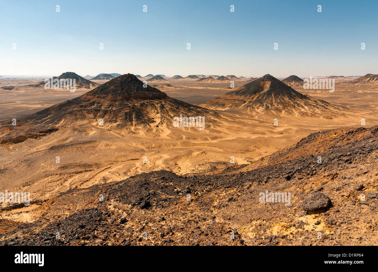 Volcano-shaped Mountains of Black Desert, Egypt Stock Photo - Alamy