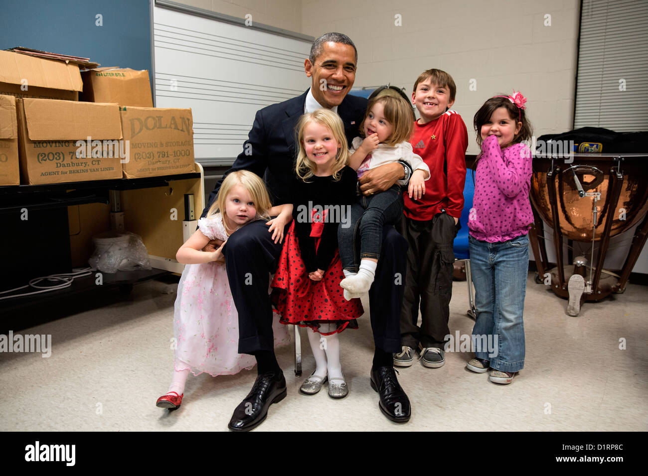 US President Barack Obama poses for a photo with the siblings and ...