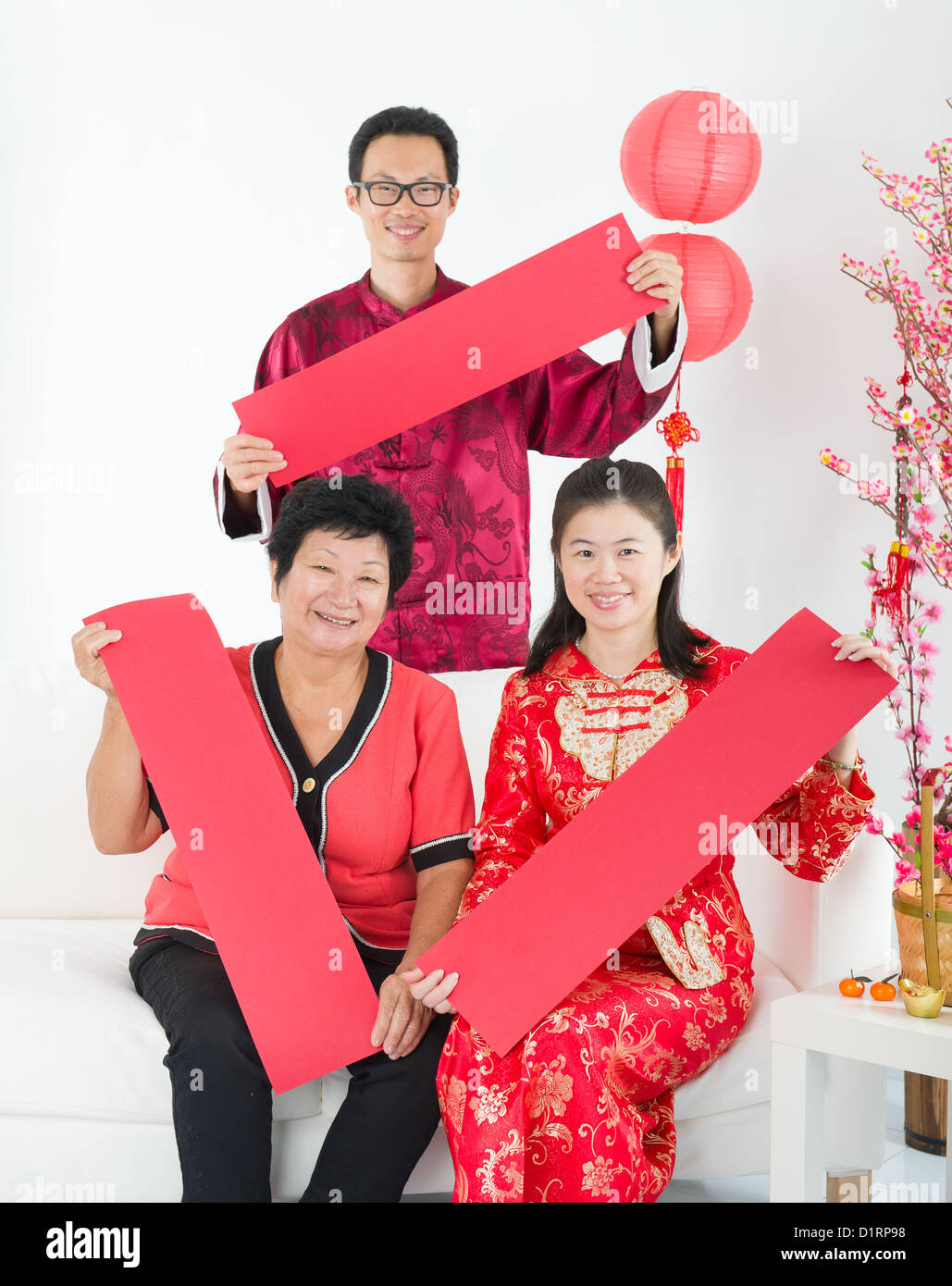 chinese new year family with new year banners Stock Photo - Alamy