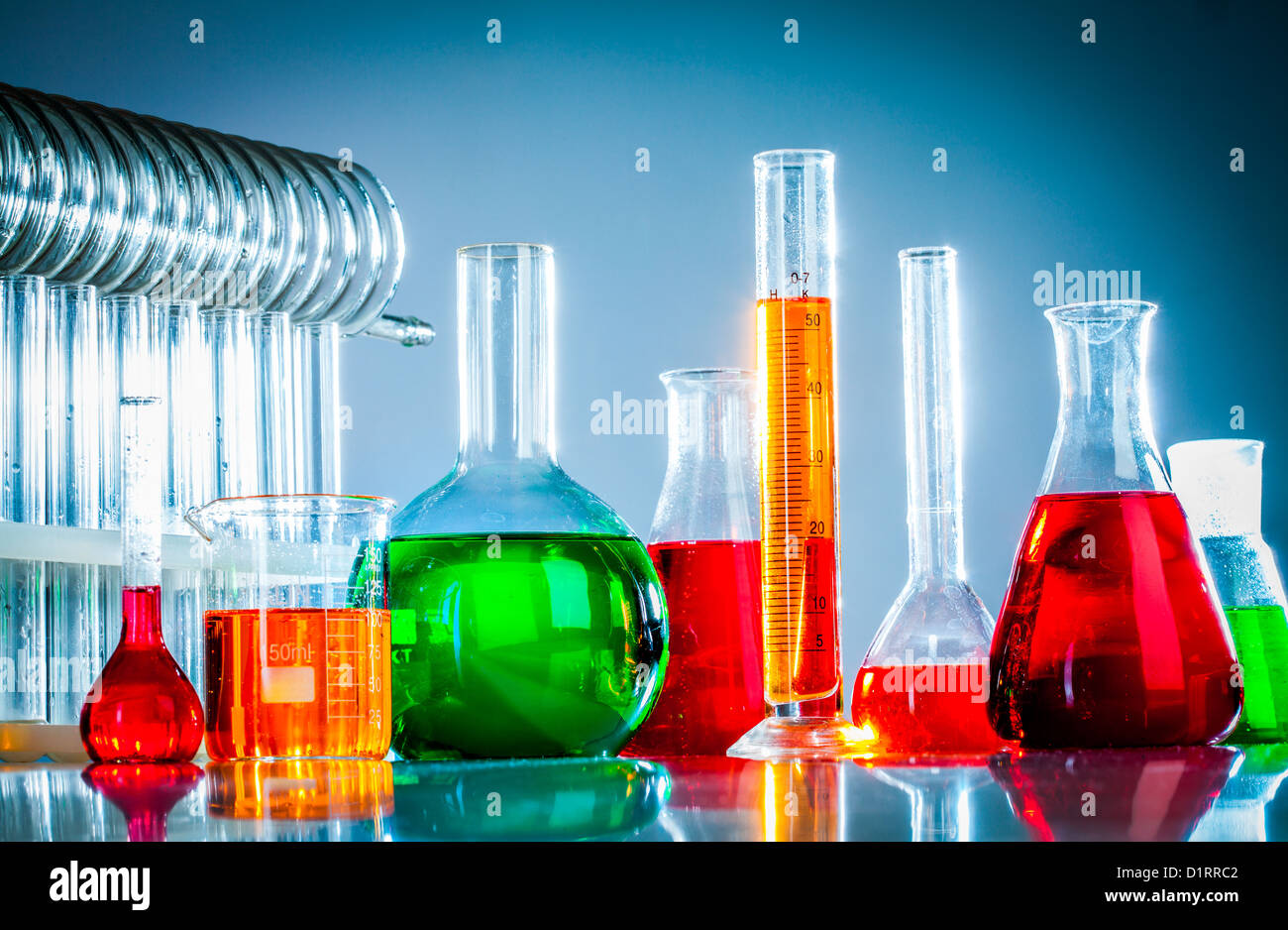 Test tubes on blue background Stock Photo - Alamy