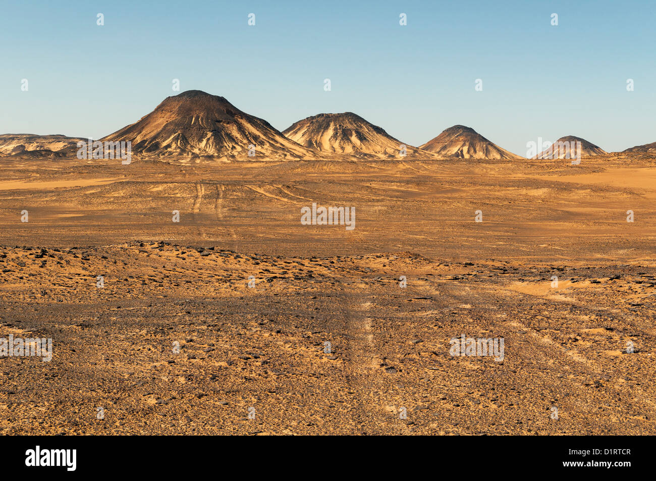 Volcano-shaped Mountains of Black Desert, Egypt Stock Photo - Alamy
