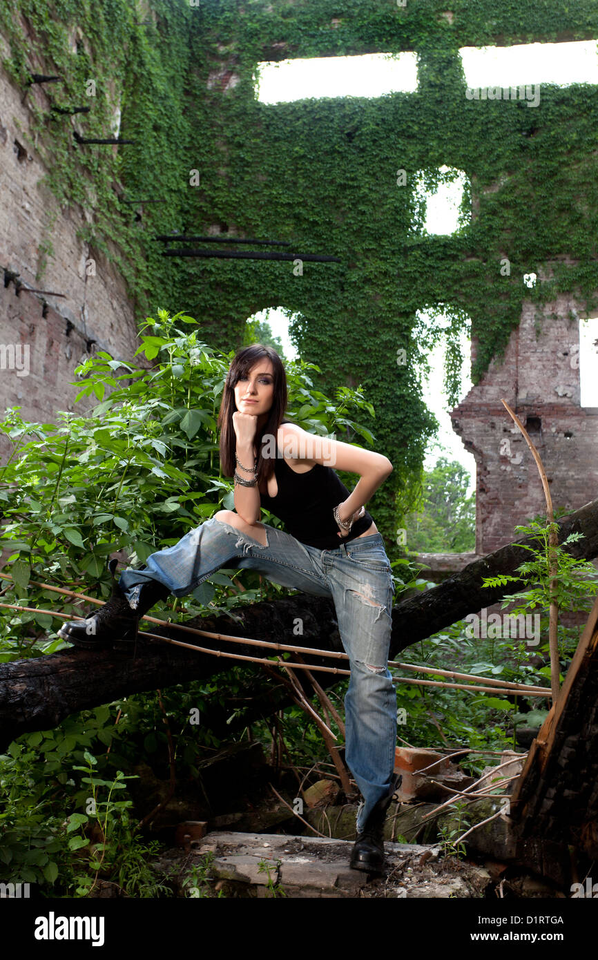 Lovely brunette in a deserted building with a ready to conquer attitude ...