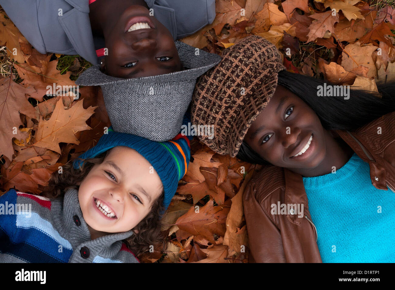 Happy family with foster children in the forest Stock Photo - Alamy