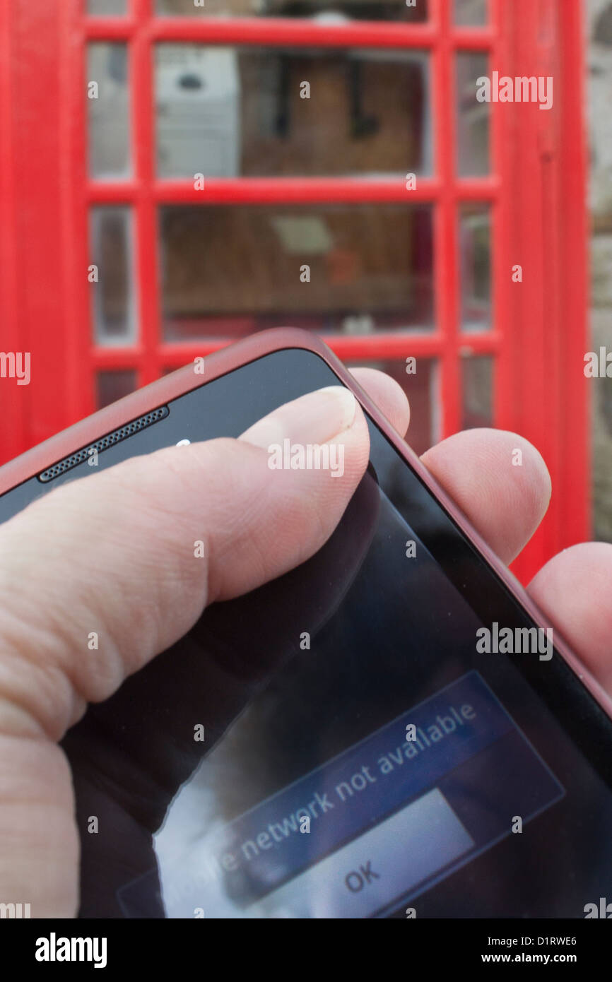 Man holding mobile phone; mobile network not available, red telephone ...