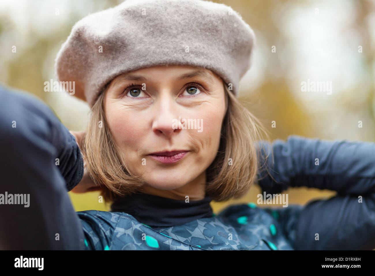 Outdoor portrait of middle aged woman wearing grey beret Stock Photo ...