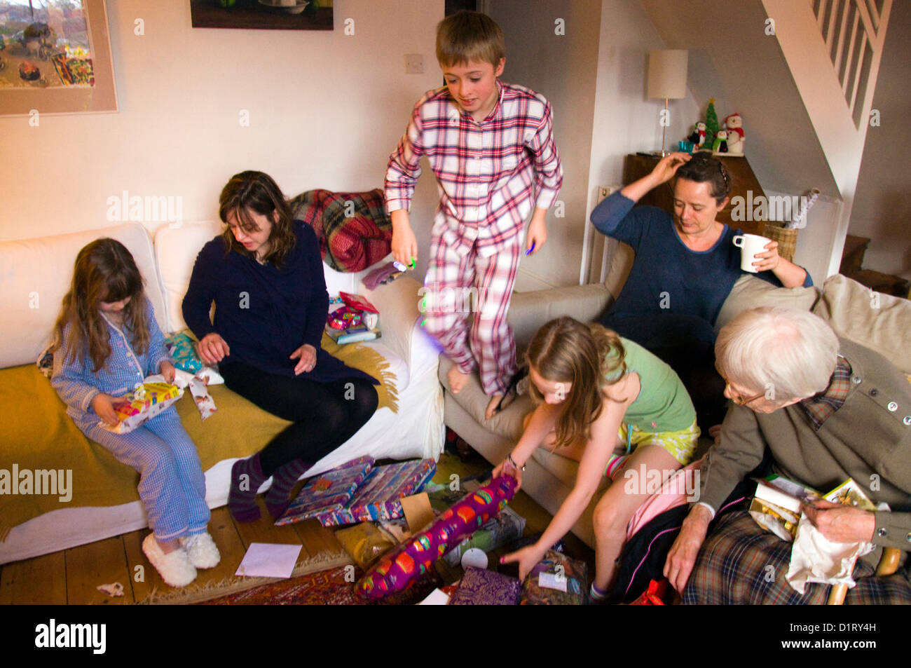 Christmas Day opening presents Stock Photo - Alamy