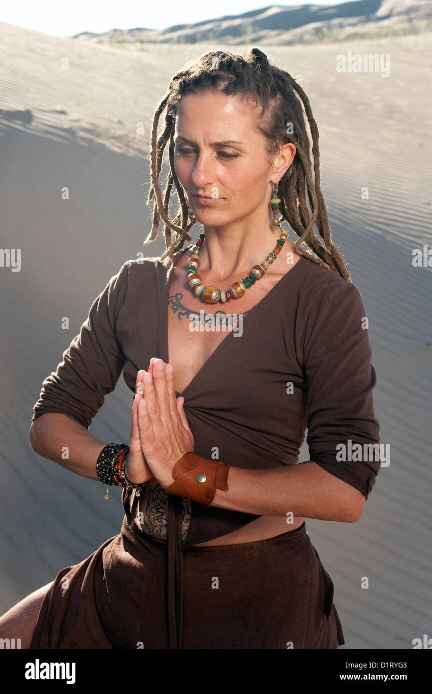 Unique yoga woman in the sand dunes Stock Photo - Alamy
