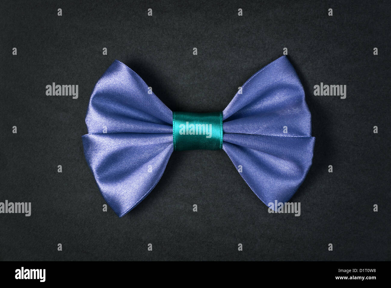 blue ribbon bow on black paper background Stock Photo - Alamy