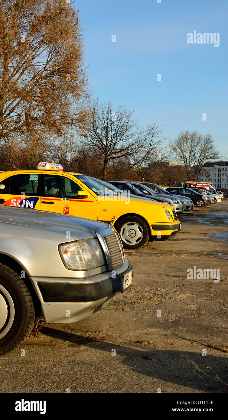 Cars in a row on parking Stock Photo - Alamy