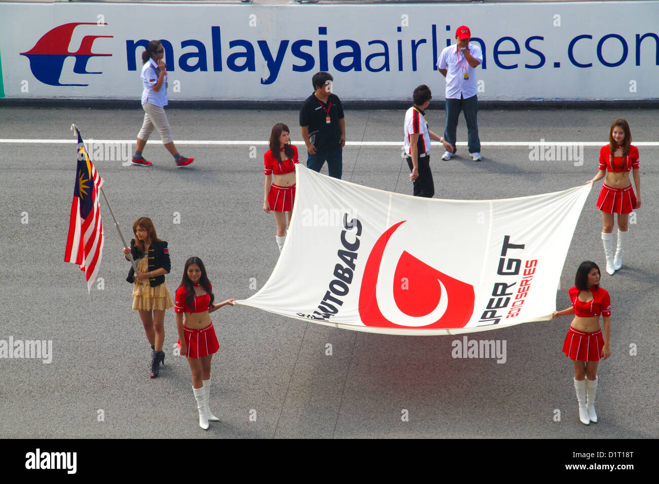 GT queens carrying event flag at SuperGT at Sepang Circuit Stock Photo ...