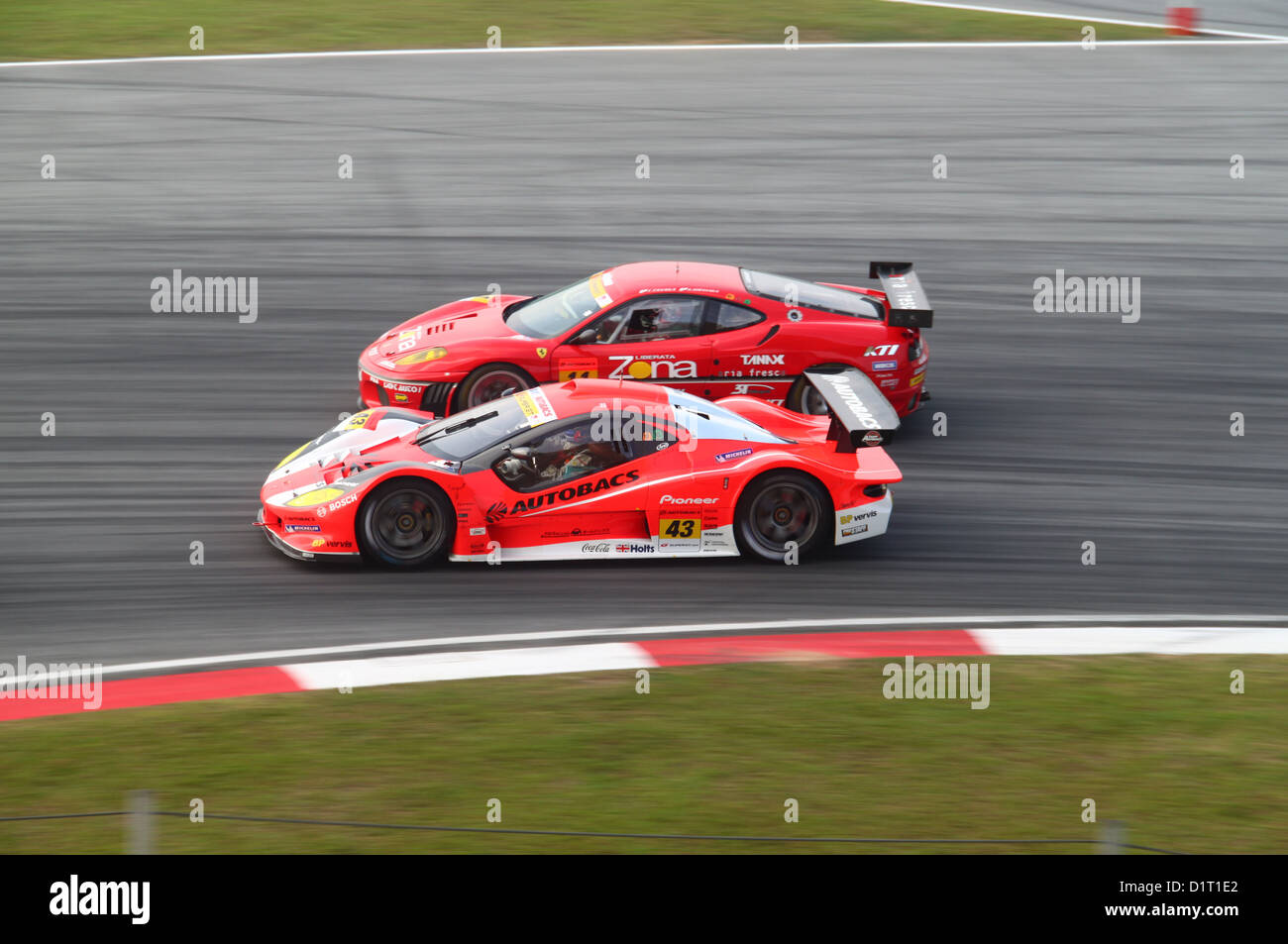 JimGainer Ferrari and Autobacs Aguri competing at Super GT race on June ...