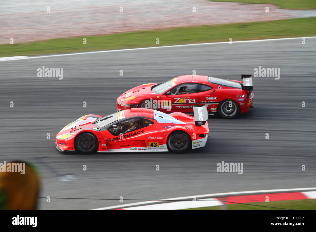 JimGainer Ferrari and Autobacs Aguri competing at Super GT race on June ...