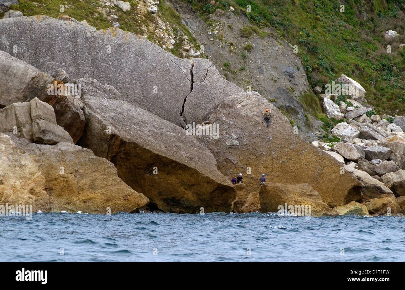 Climbers at Mutton Cove, Portland, on the Jurassic Coast of Dorset, UK ...