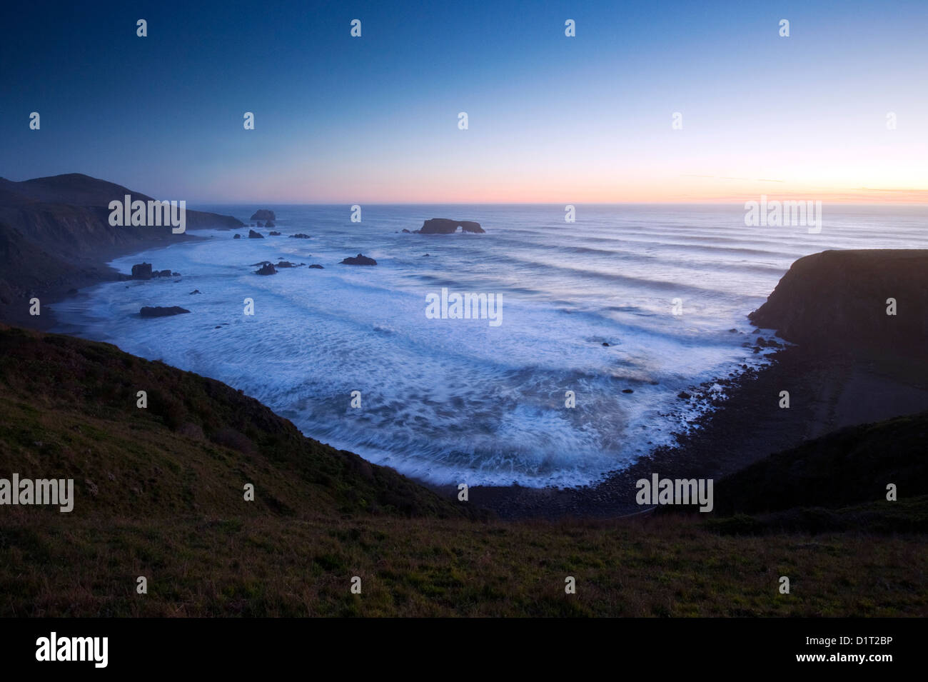 Looking down on Blind Beach and Arch Rock at sunset in Goat Rock State ...