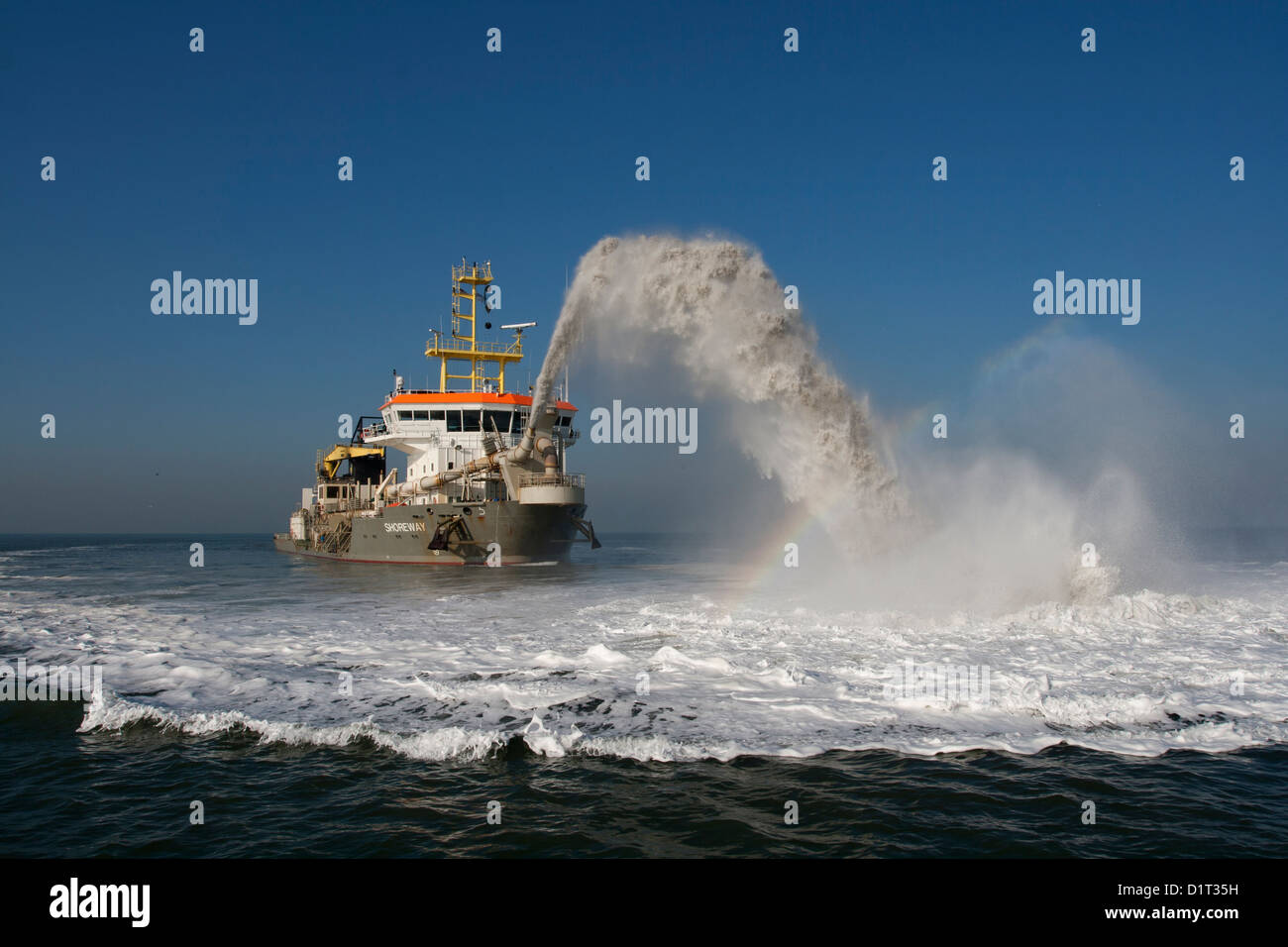 Trailing suction hopper dredger, Shoreway, 'rainbowing' (depositing ...