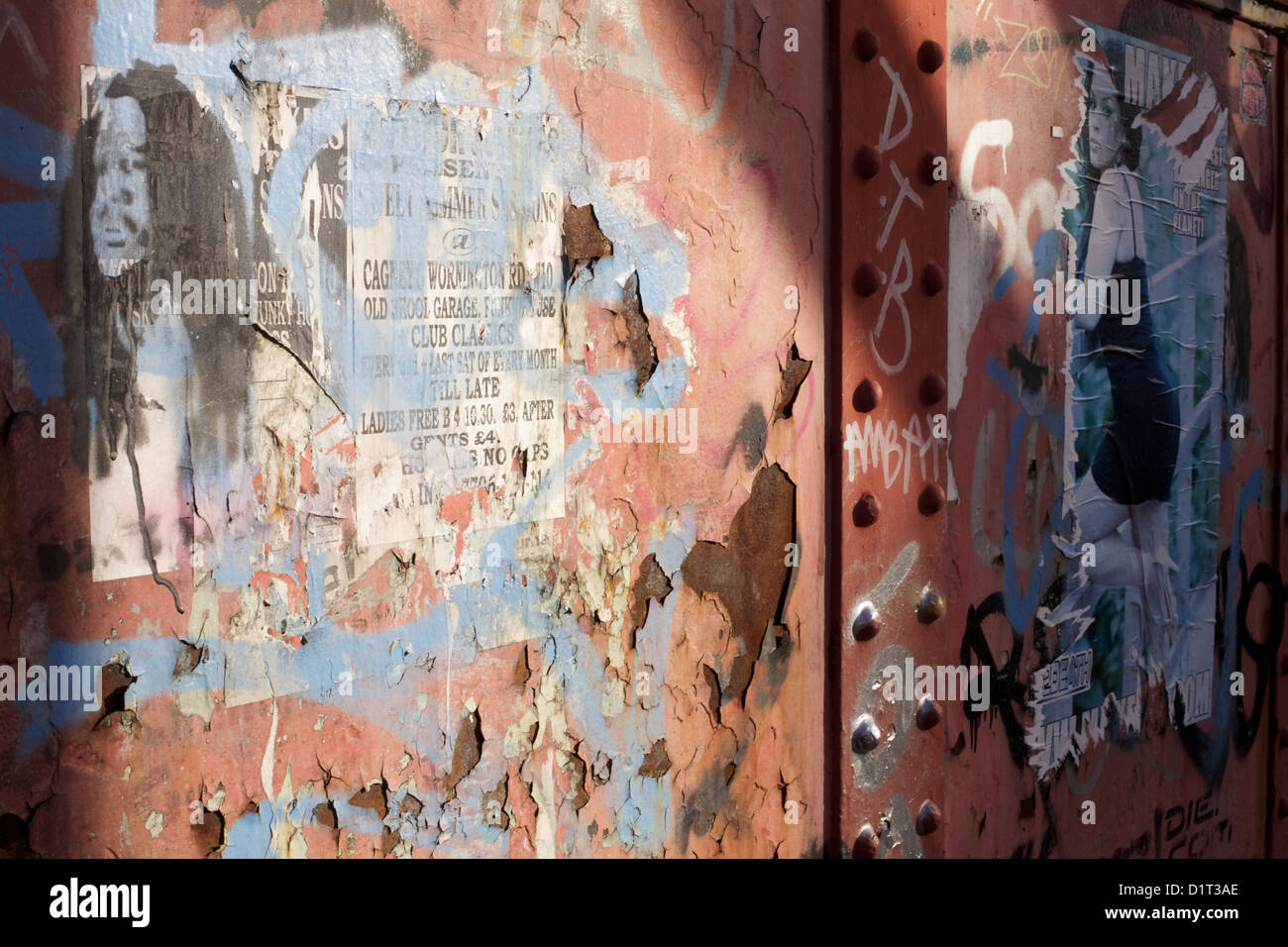 Reggae Posters stuck to rusty bridge in the sunshine, Ladbroke Grove ...