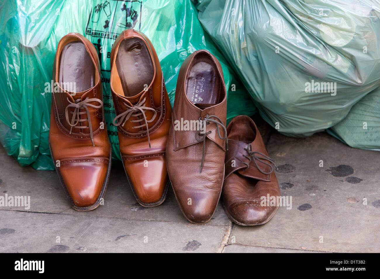 Two pairs of brown leather shoes thrown out with the rubbish in London ...