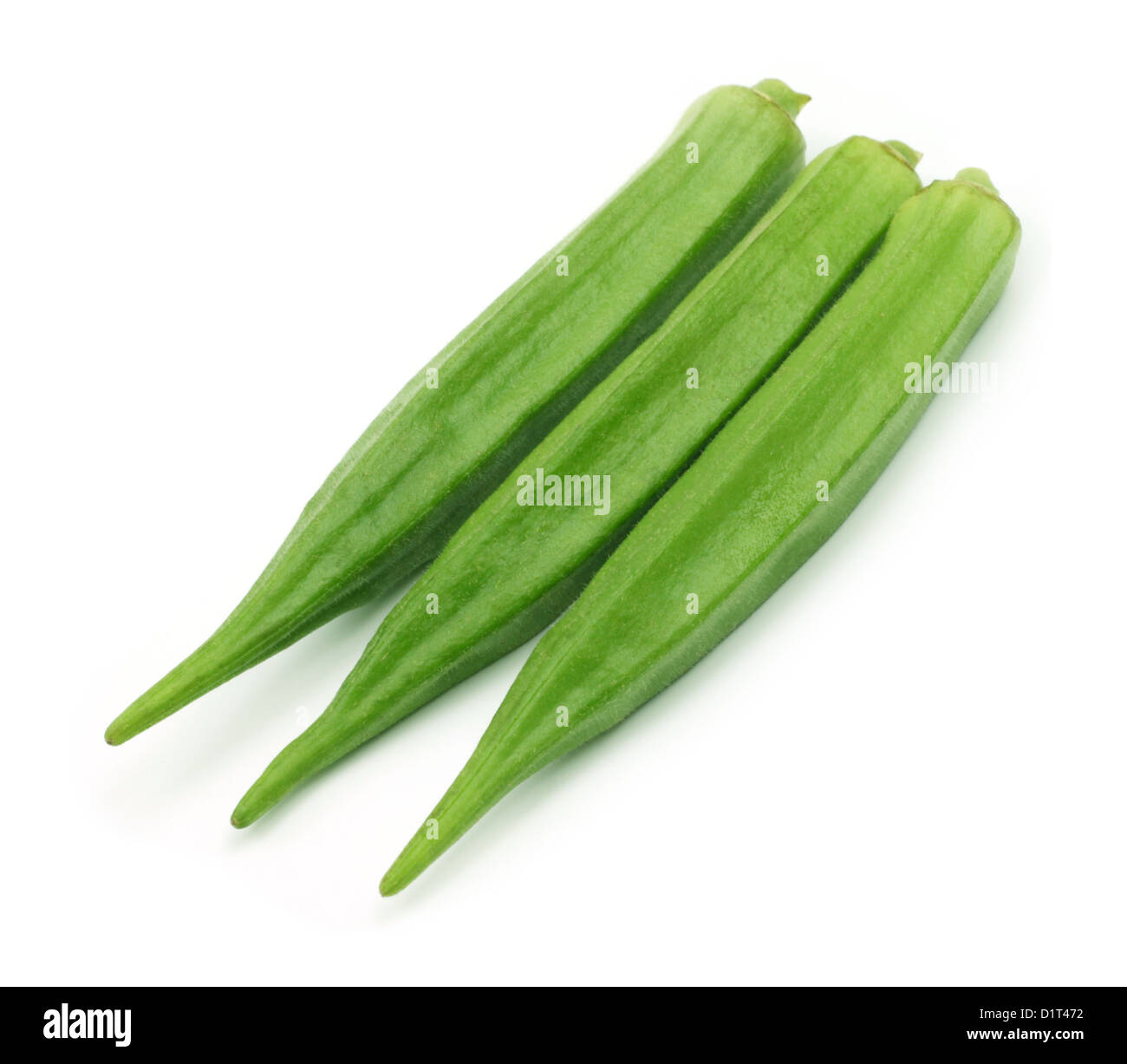 Okras on white background Stock Photo - Alamy