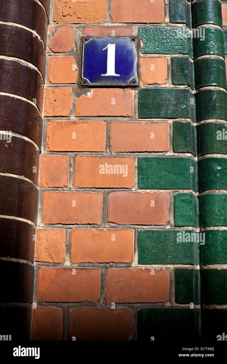 House Number One on brick wall Stock Photo - Alamy