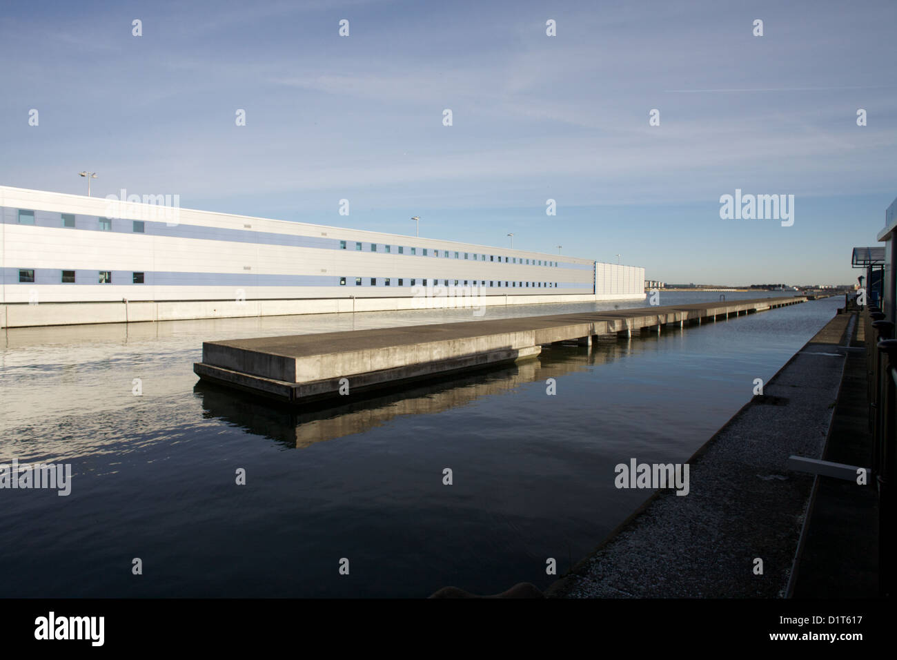 Waterway by London City Airport runway, London, England, UK Stock Photo ...