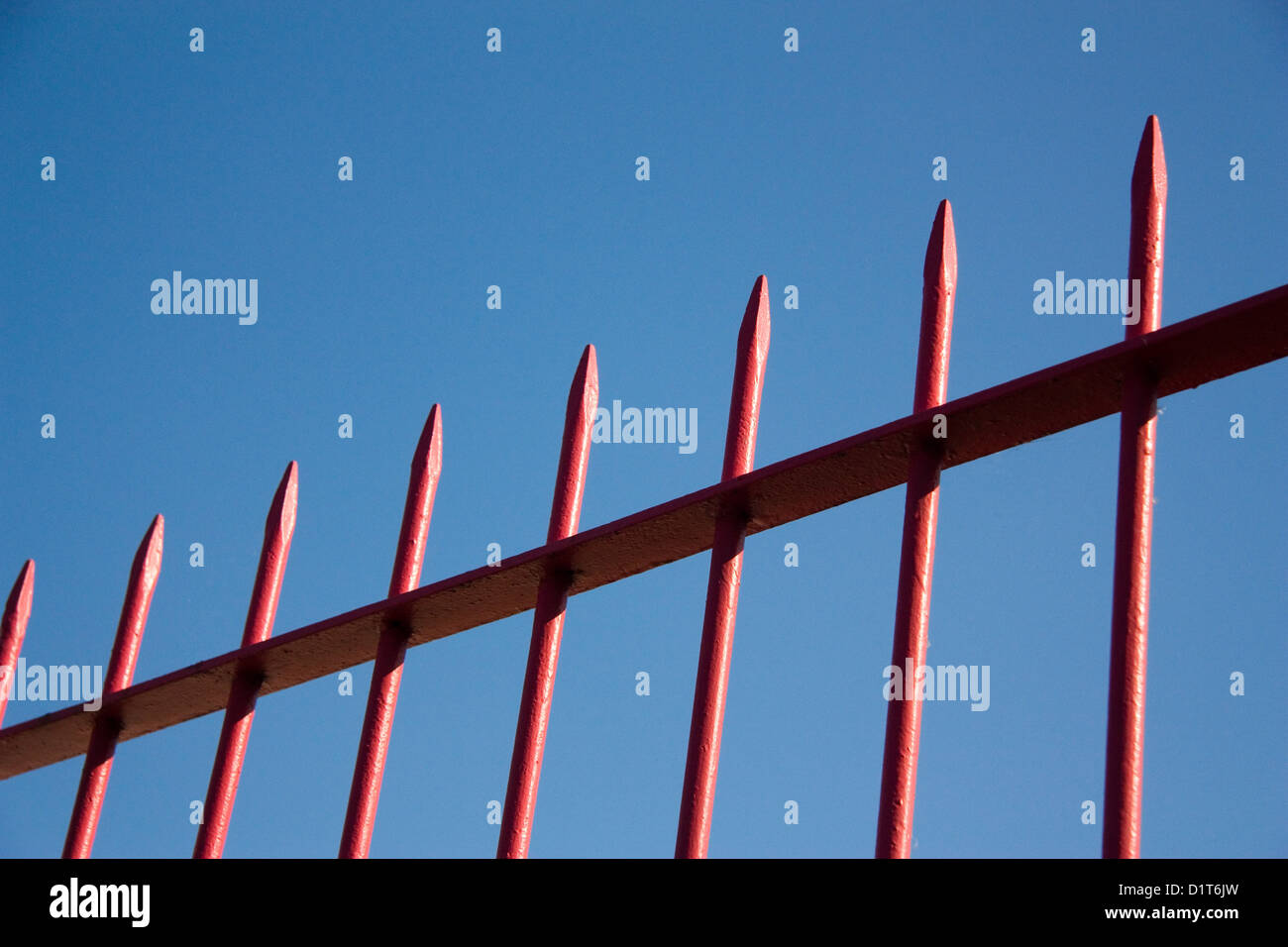 Berlin, Germany, red iron fence against blue sky Stock Photo - Alamy