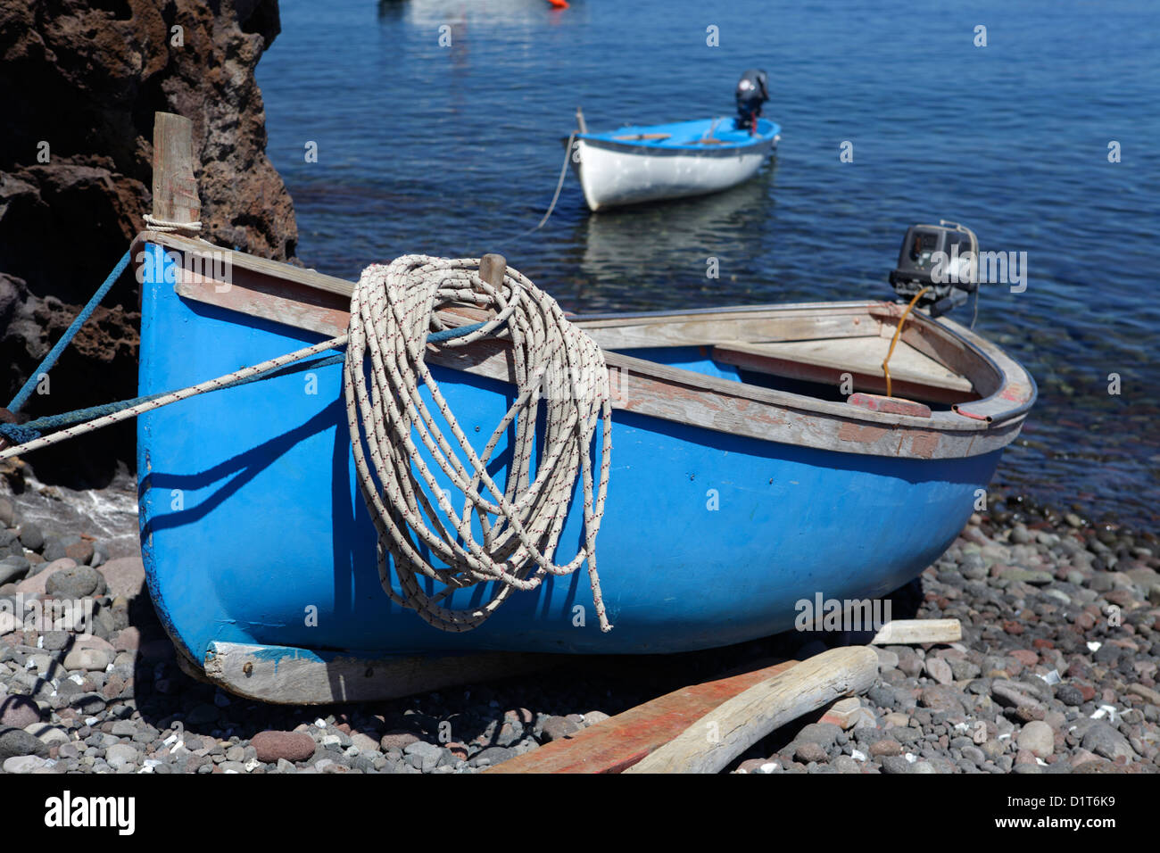 Rowing boat at the little port of Alicudi, Aeolian Islands, Sicily ...