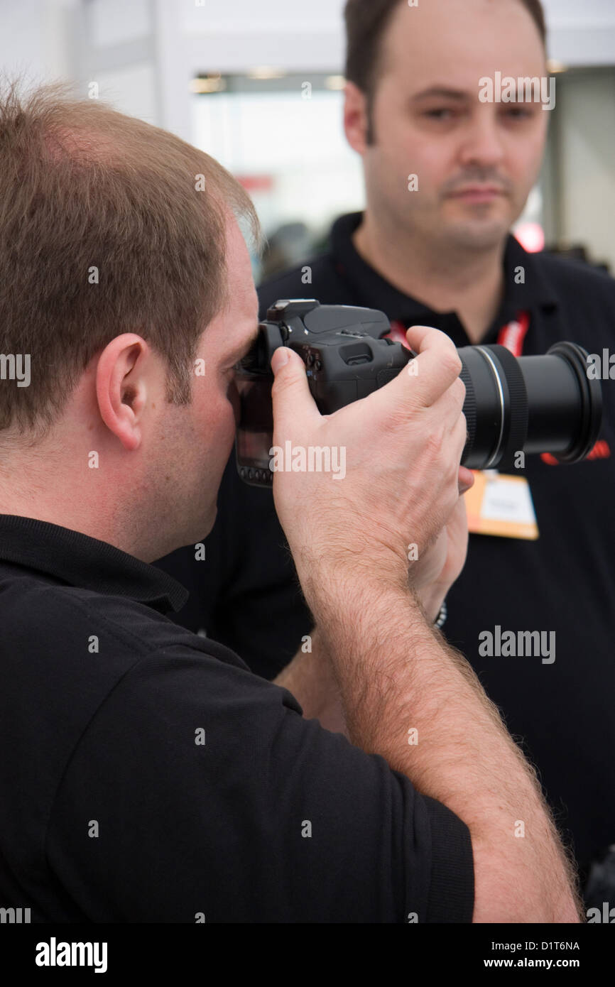 Berlin, Germany, visitors test Canon camera Stock Photo - Alamy