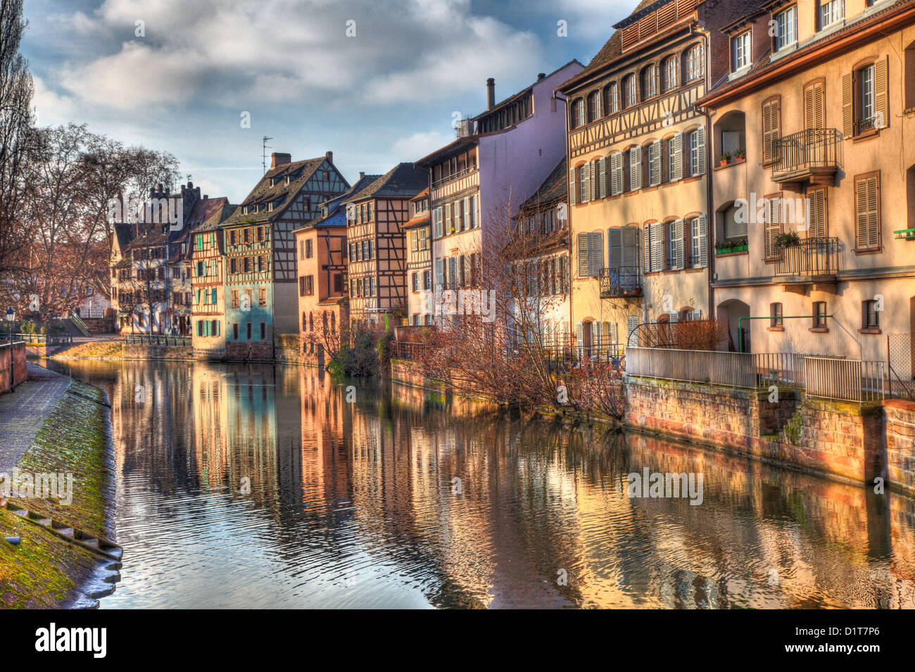 Beautiful reflections at the sunset of traditional buildings in a water ...